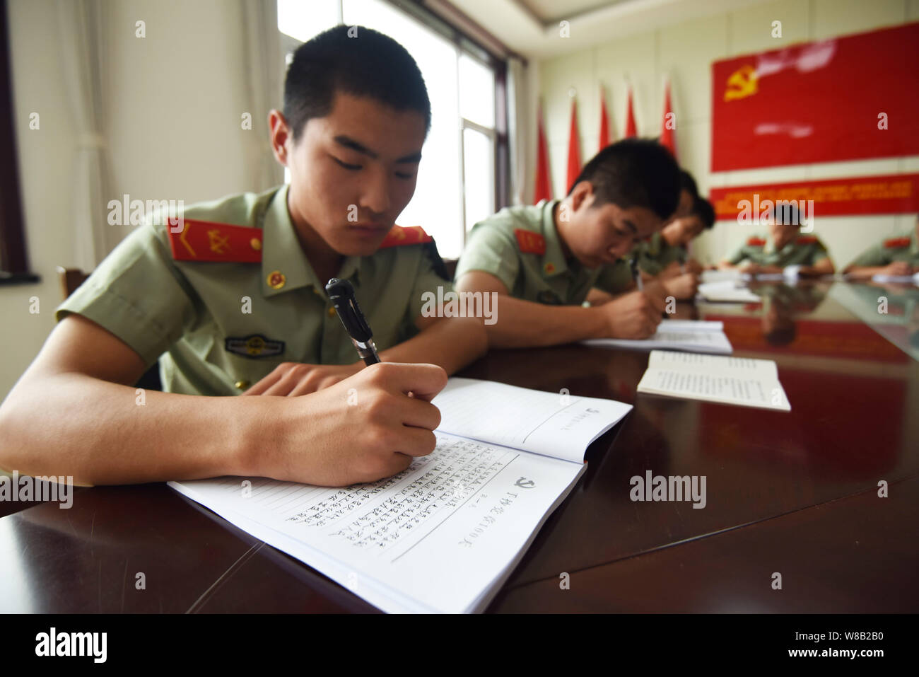 Chinese paramilitary policemen hand copy the constitution of the ...