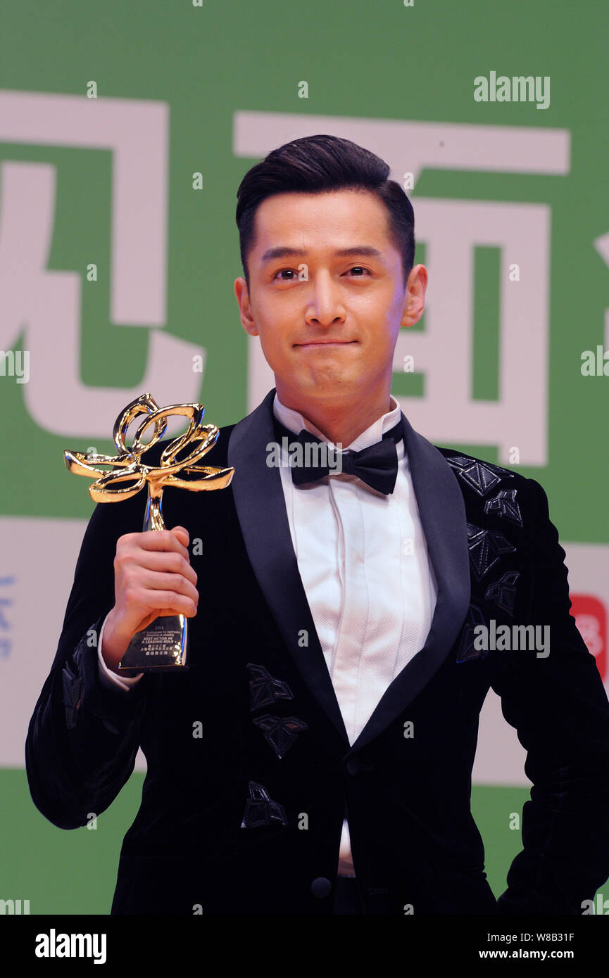 Chinese actor Hu Ge poses with his trophy for the Best Actor award for ...