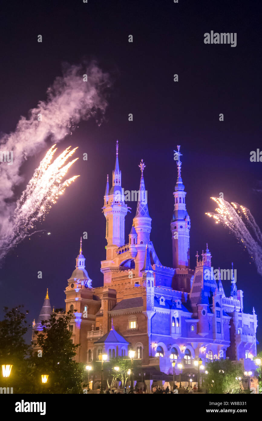 Fireworks explode over the Disney Castle in the Shanghai Disneyland ...