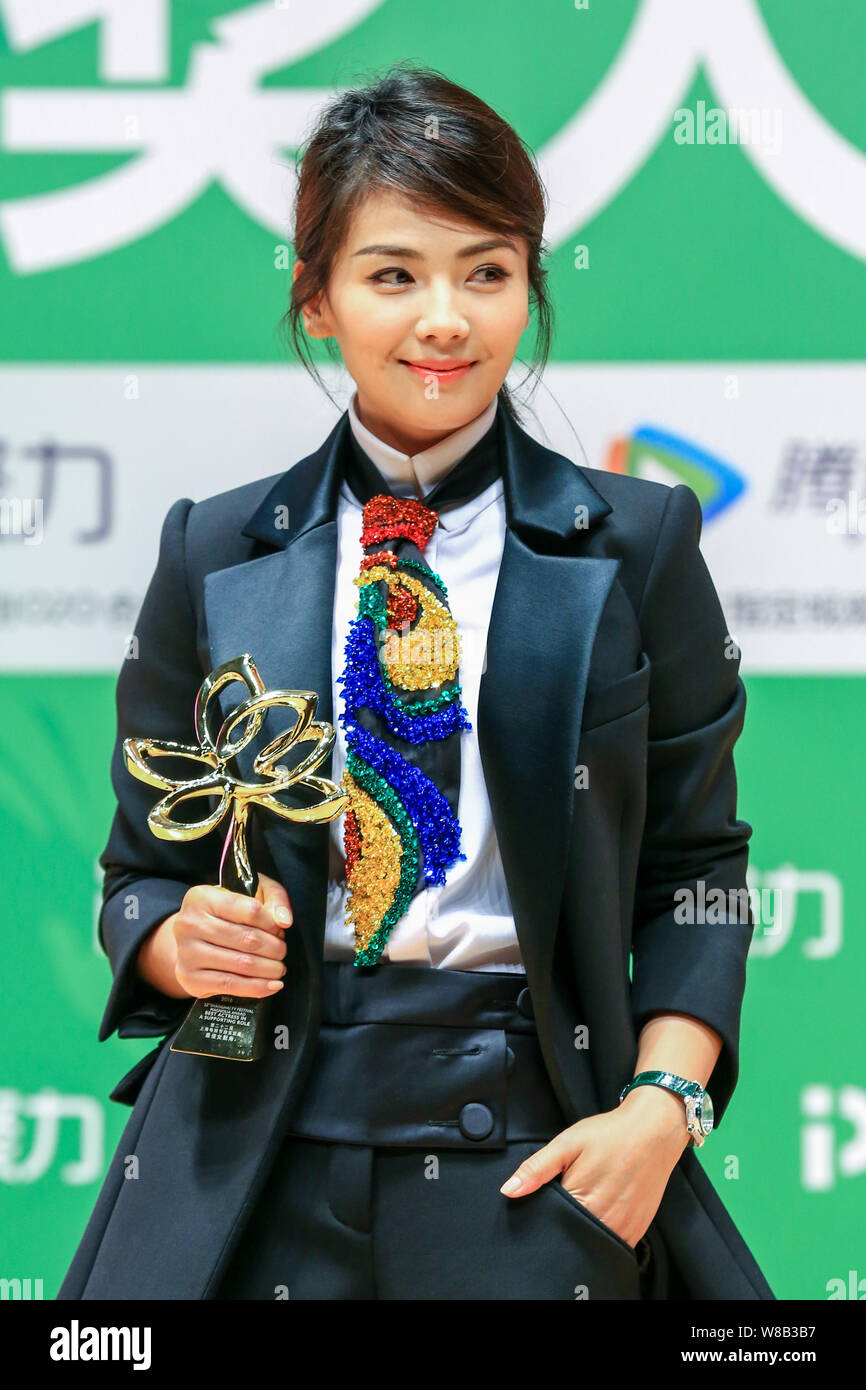 Chinese actress Liu Tao poses with her trophy for the Best Supporting ...