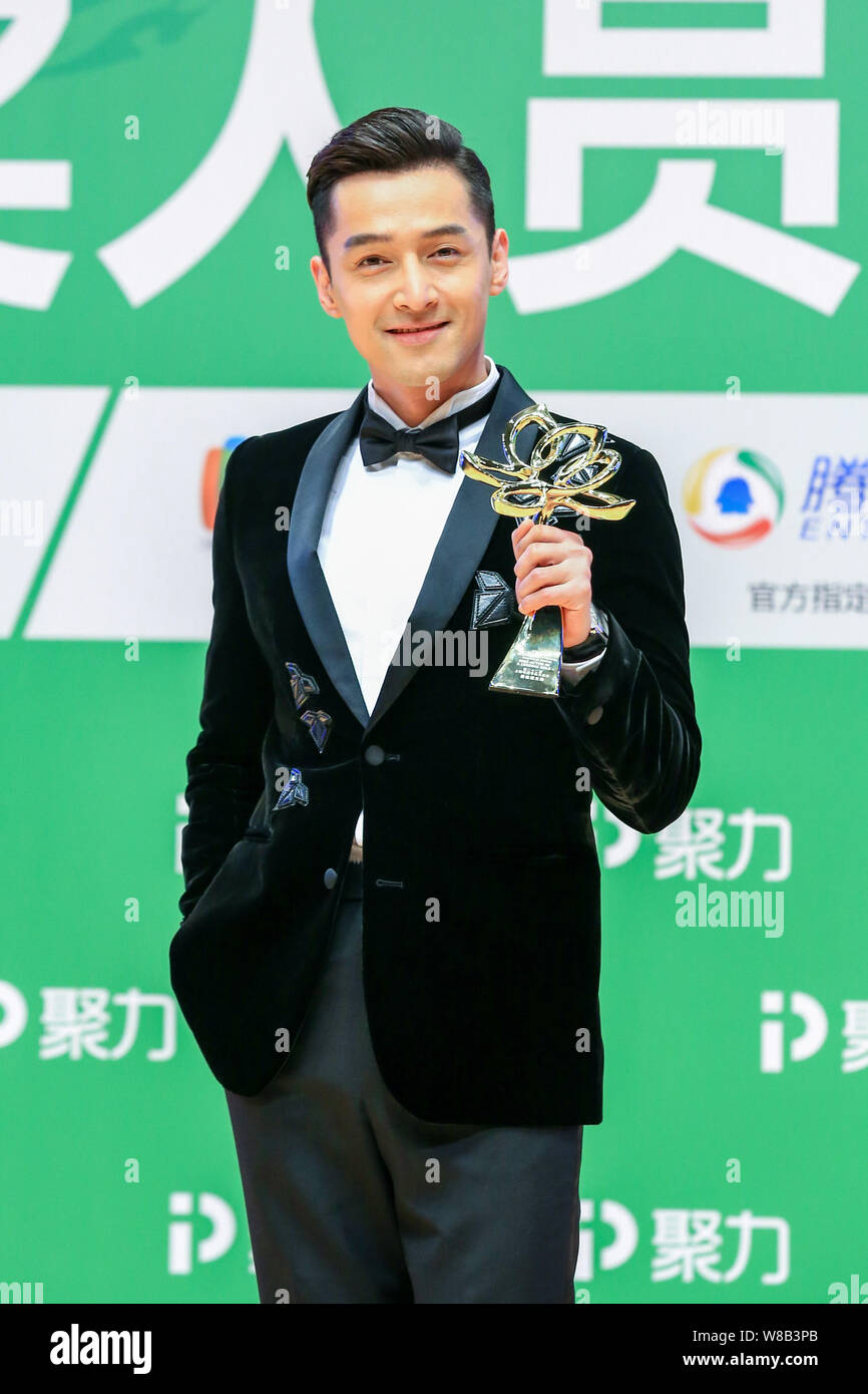 Chinese actor Hu Ge poses with his trophy for the Best Actor award for ...