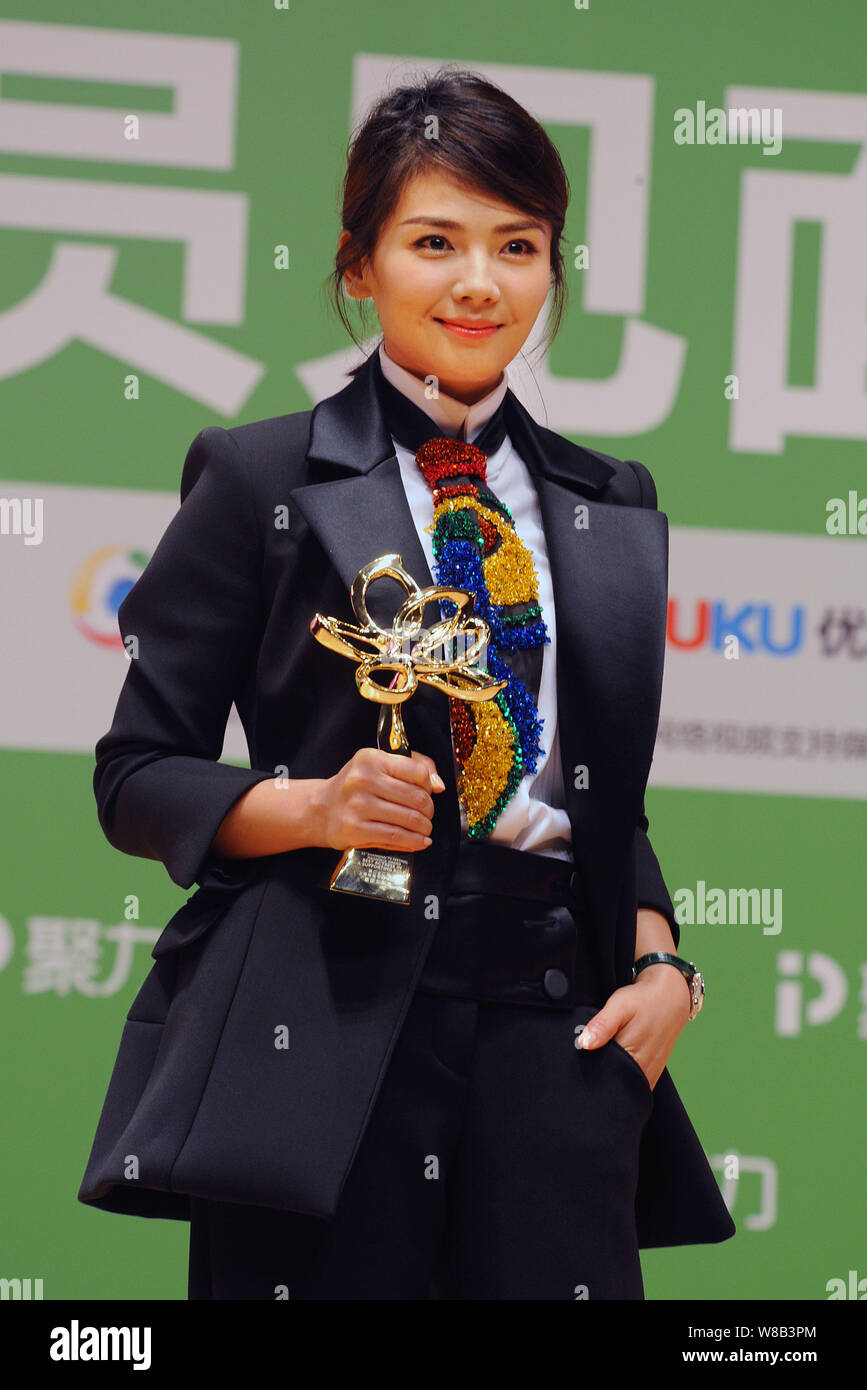 Chinese actress Liu Tao poses with her trophy for the Best Supporting ...