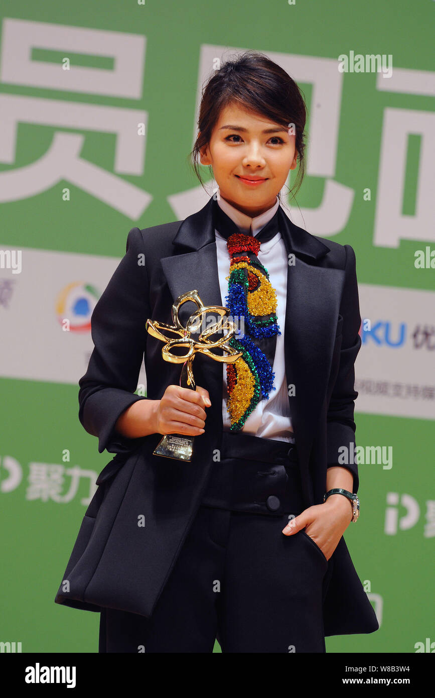 Chinese actress Liu Tao poses with her trophy for the Best Supporting ...
