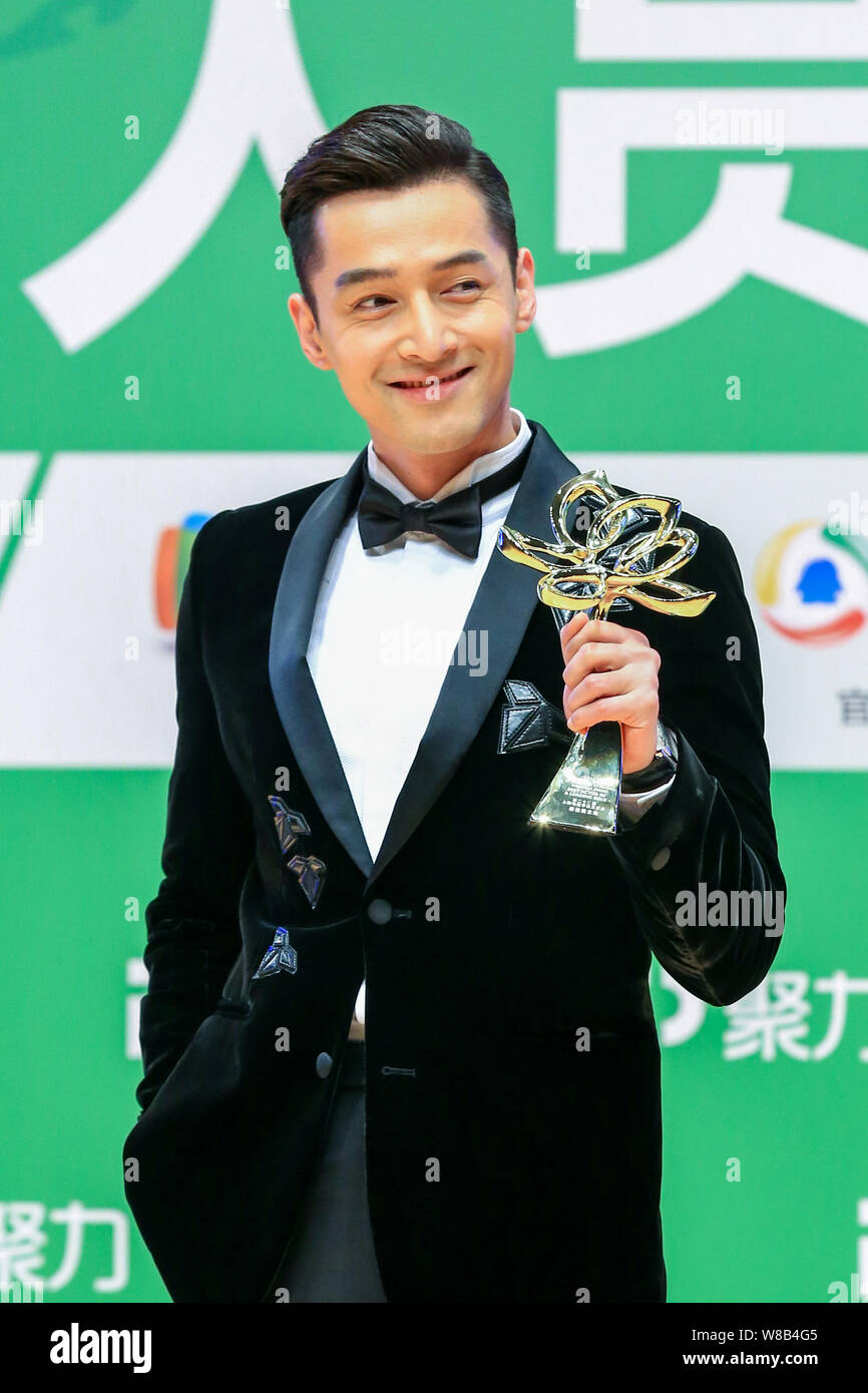 Chinese actor Hu Ge poses with his trophy for the Best Actor award for ...