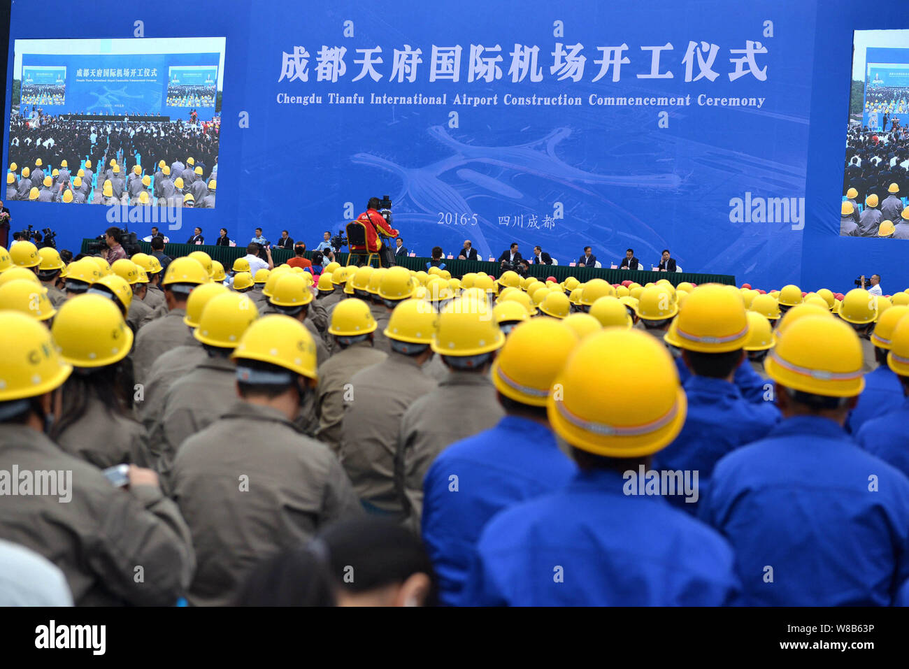 Chinese officials and workers attend the construction commencement ...