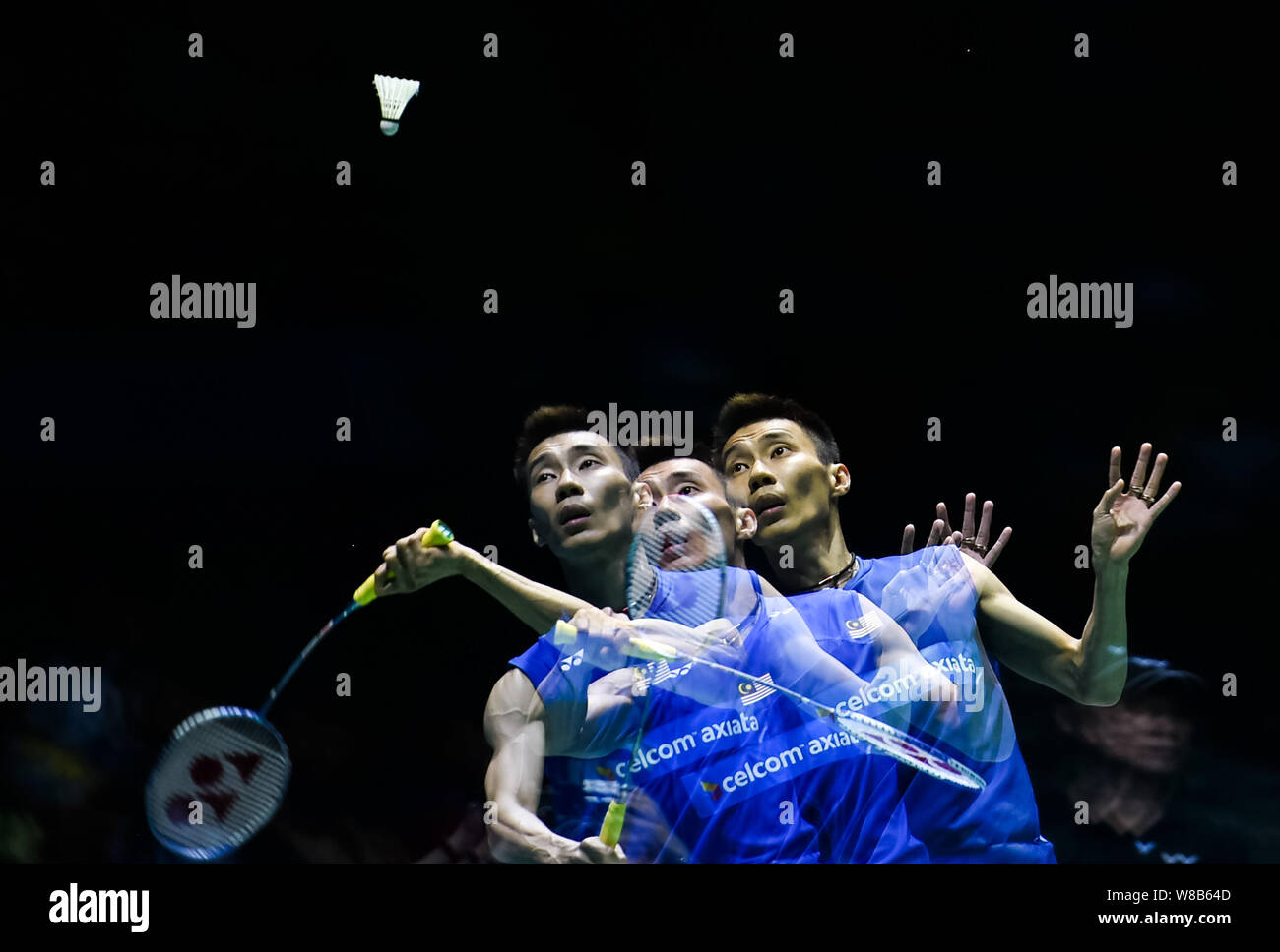 Datuk Lee Chong Wei of Malaysia returns a shot to Chen Long of China in ...