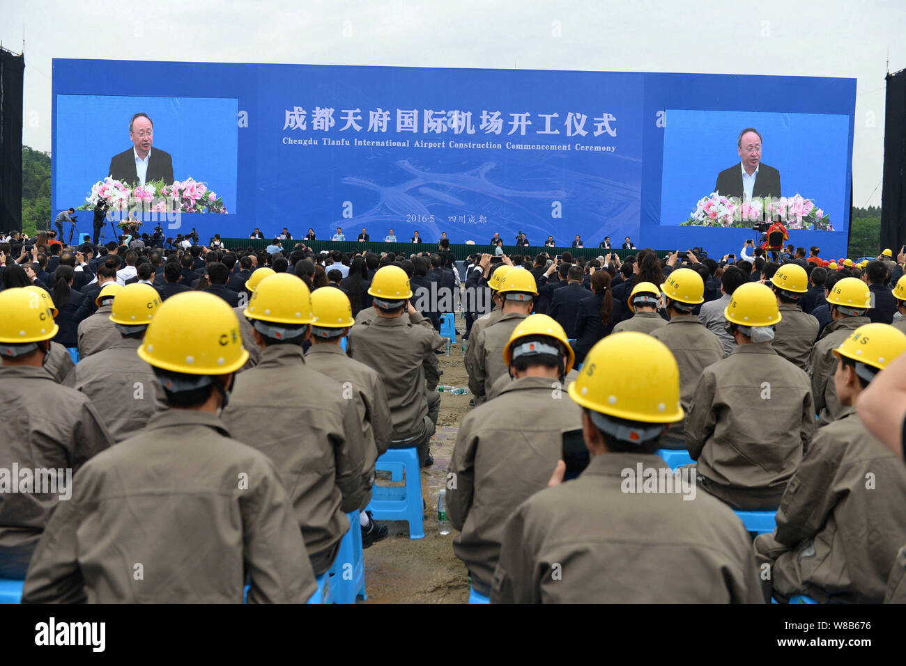 Chinese officials and workers attend the construction commencement ...
