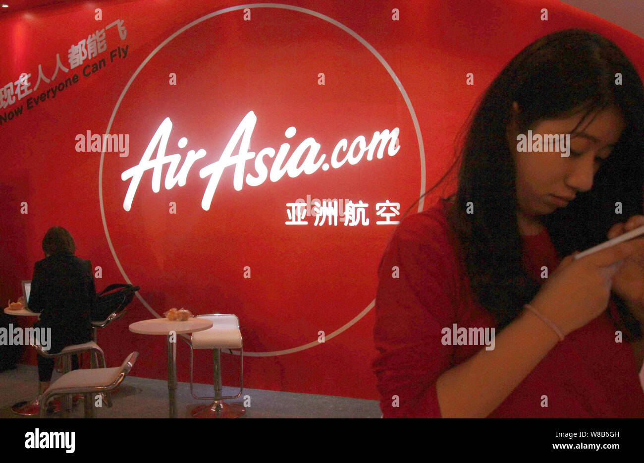 --FILE--People visit the stand of Malaysia's airlines AirAsia during a ...