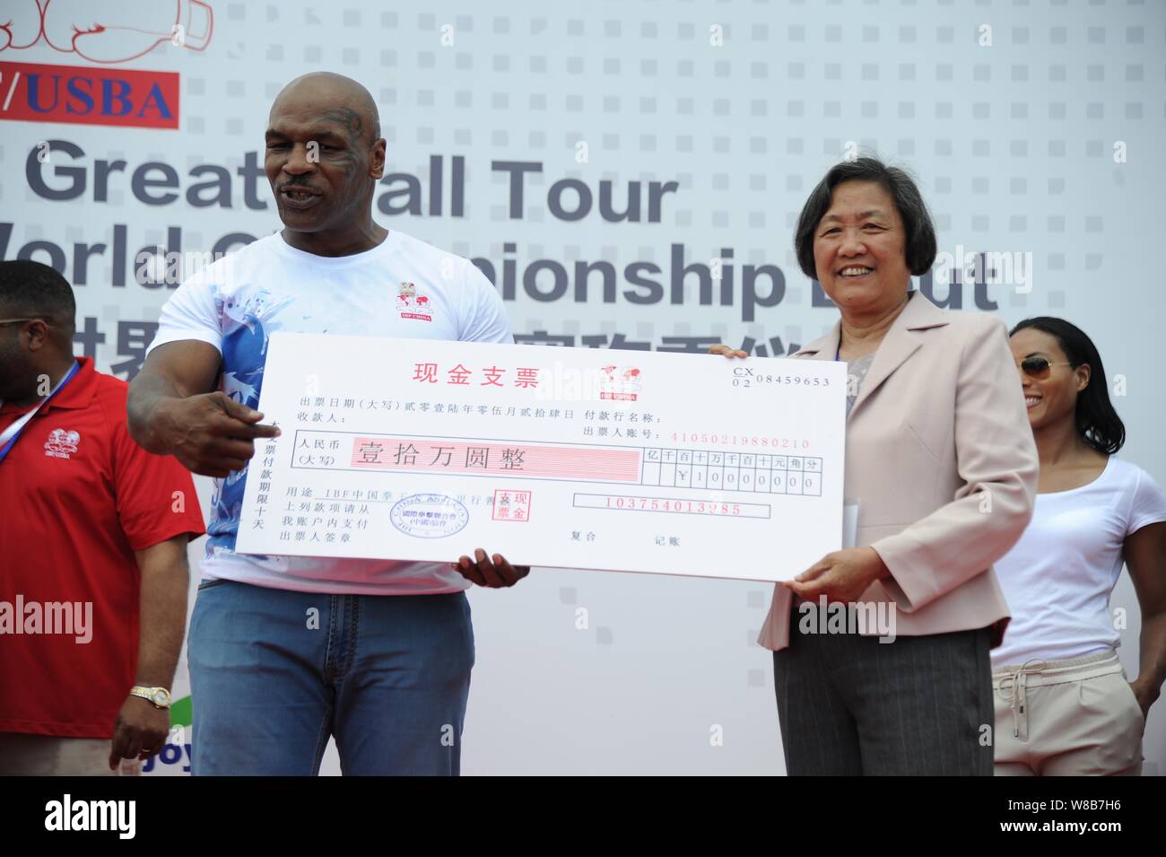 American boxer Mike Tyson, left, poses at the Weigh-In of IBF World ...
