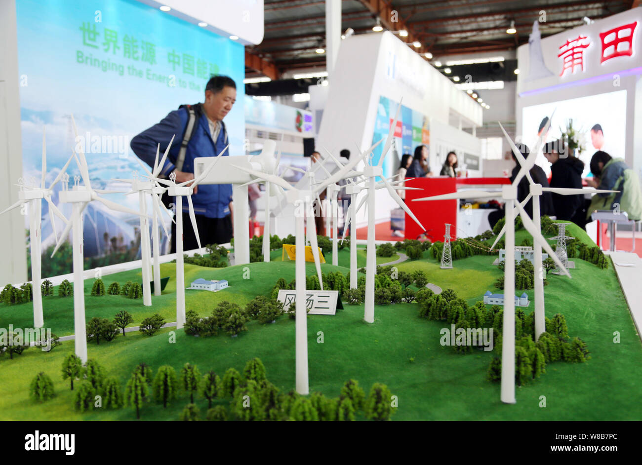 --FILE--A visitor looks at models of wind turbines during the Clean ...
