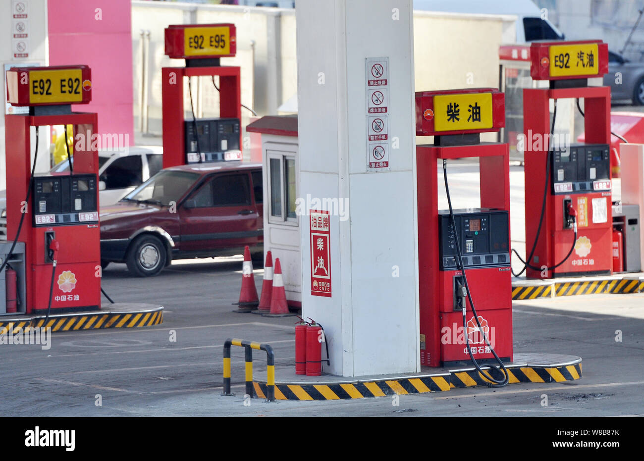 --FILE--Cars are being refueled at a gas station of PetroChina, a ...