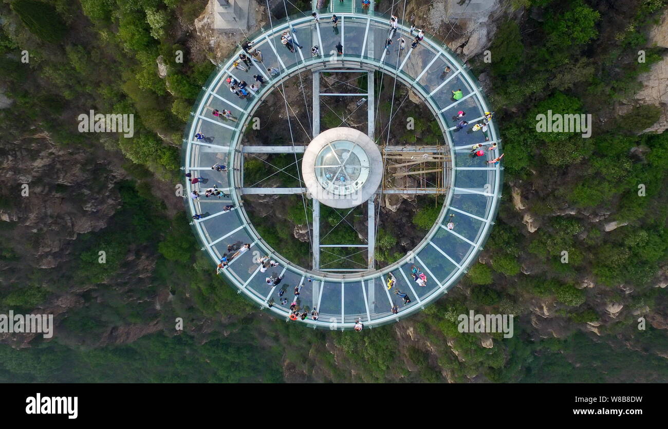Tourists visit the glass sightseeing platform in the Shilinxia scenic ...