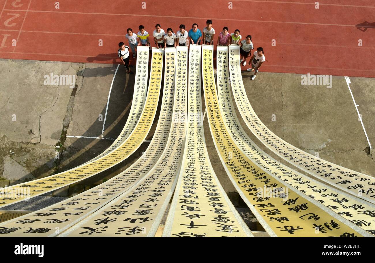 Young Chinese students display scrolls of their calligraphy work "Moyun ...