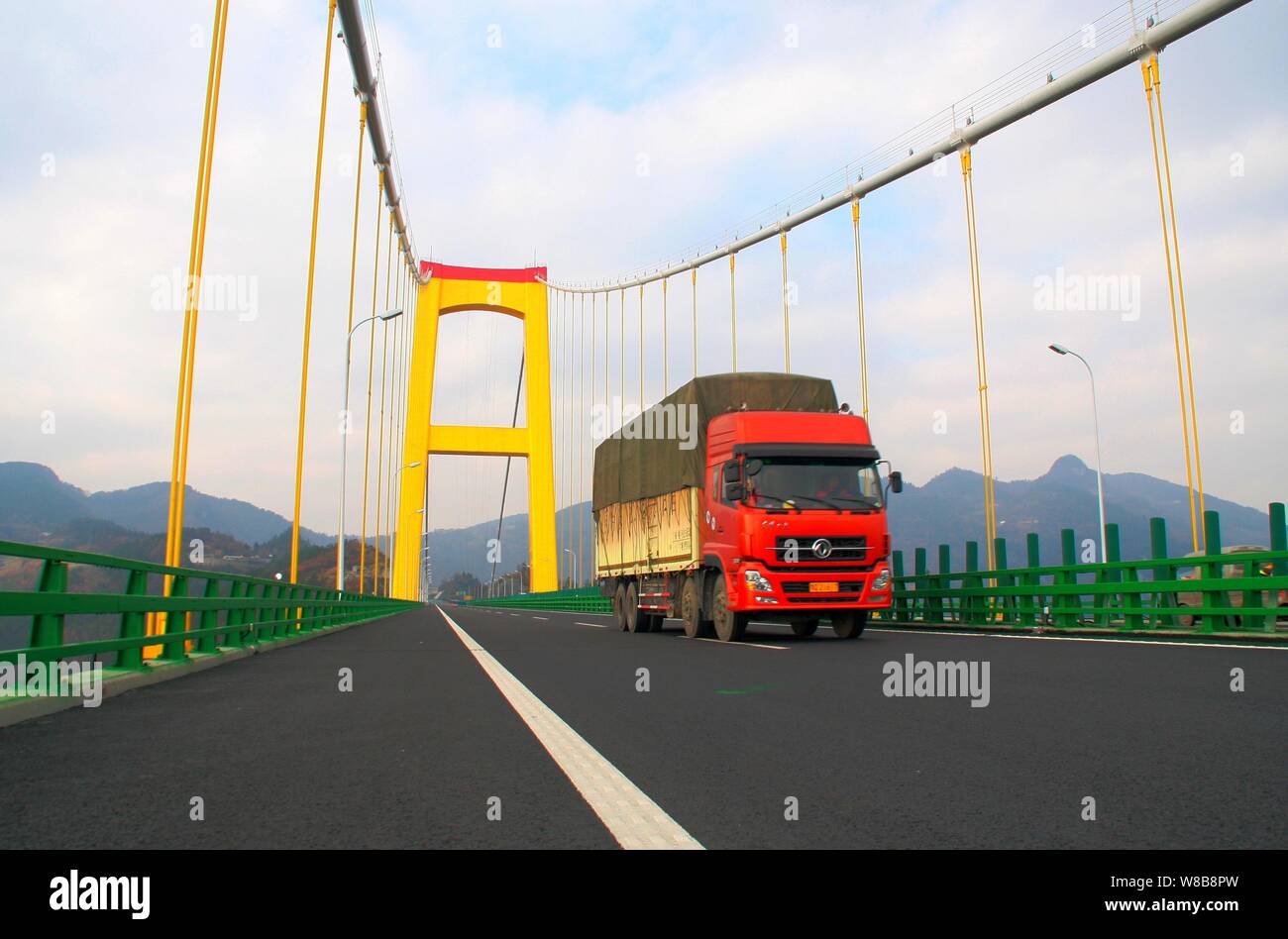 --FILE--A truck travels on the Sidu River Bridge crossing the valley of ...
