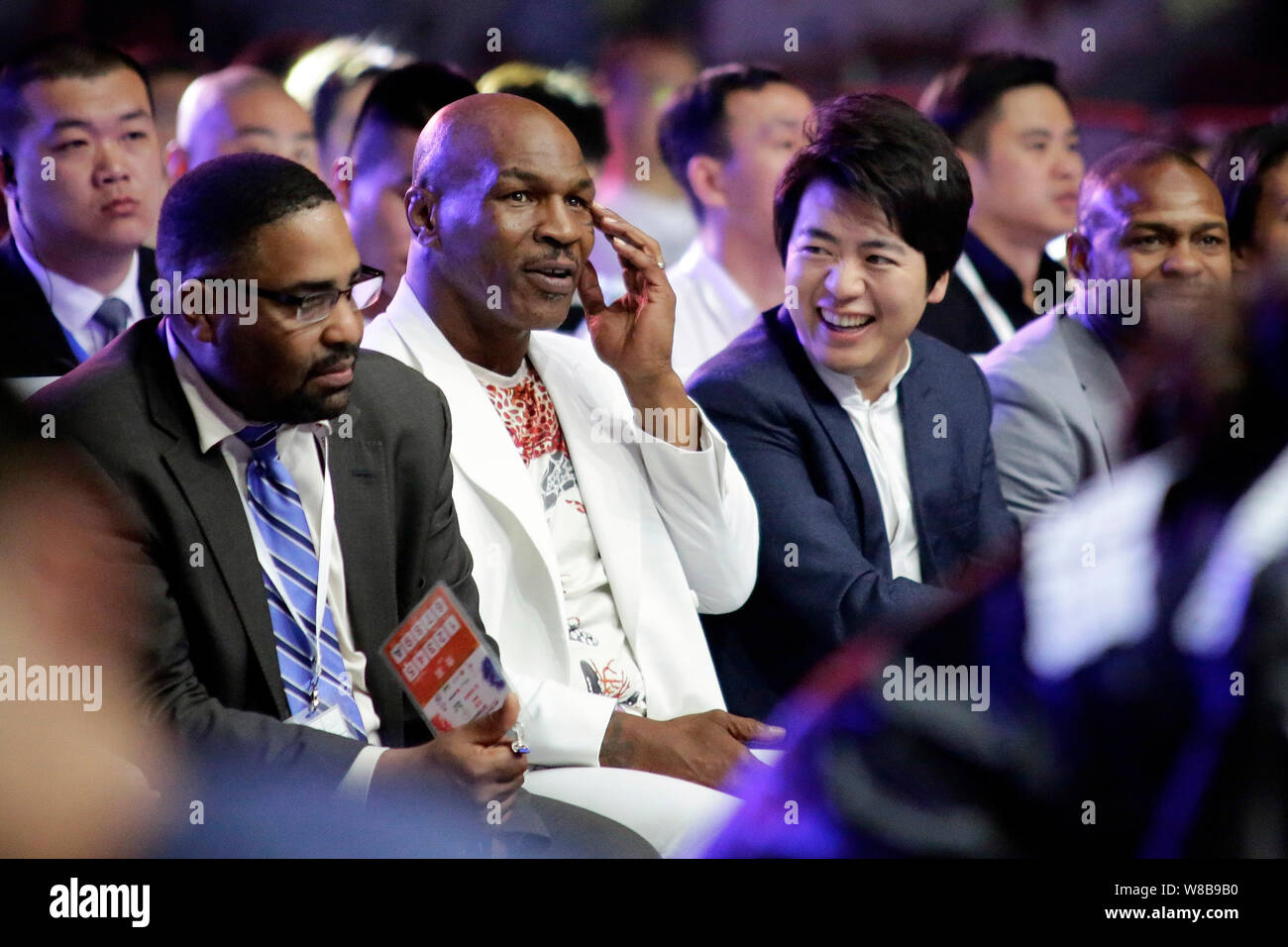 American boxer Mike Tyson, second left, and Chinese pianist Lang Lang ...