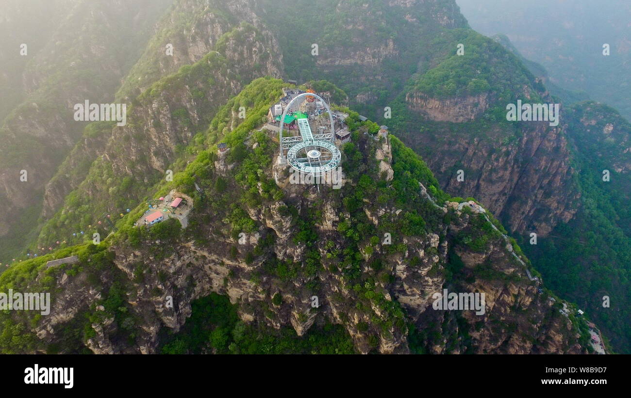 Tourists visit the glass sightseeing platform in the Shilinxia scenic ...