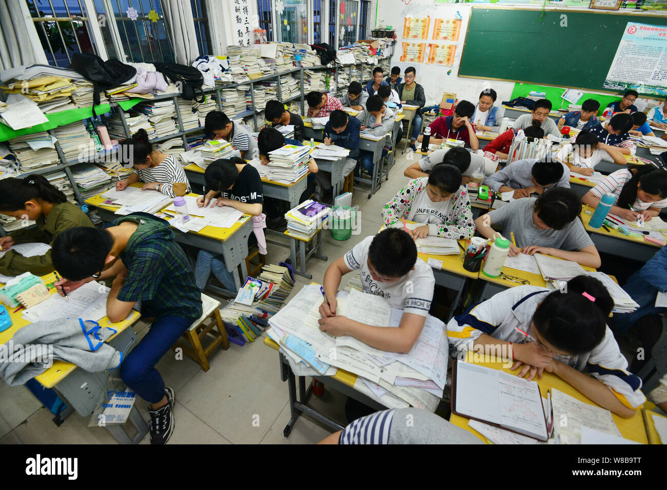 Chinese students review textbooks in preparation for the upcoming ...