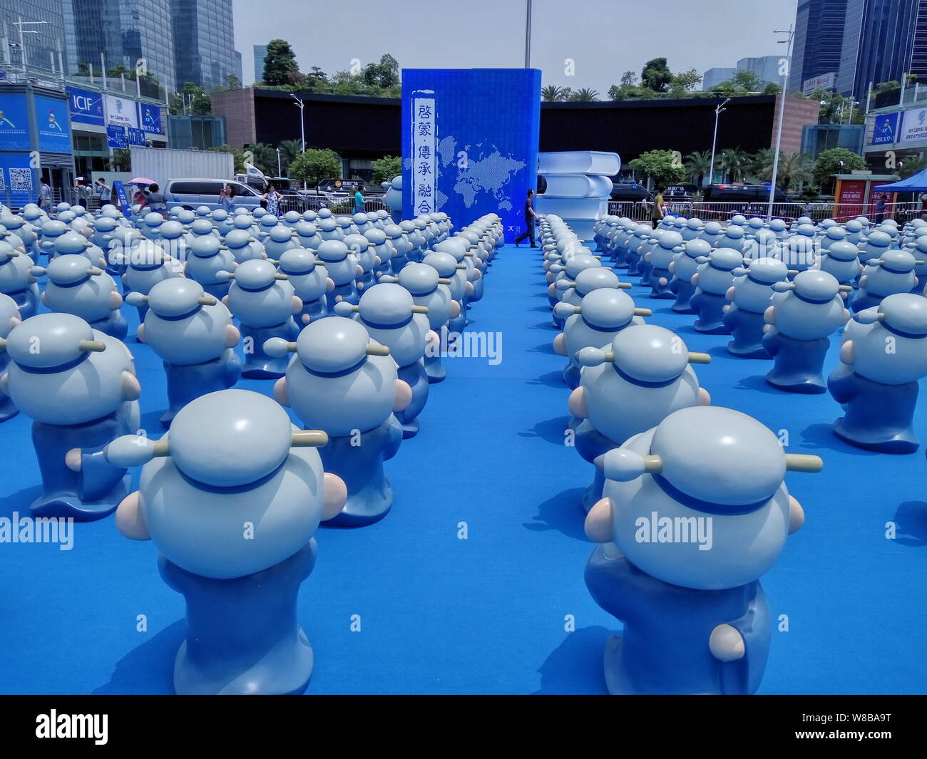 Cartoon figures of Confucius are on display during the 12th China ...