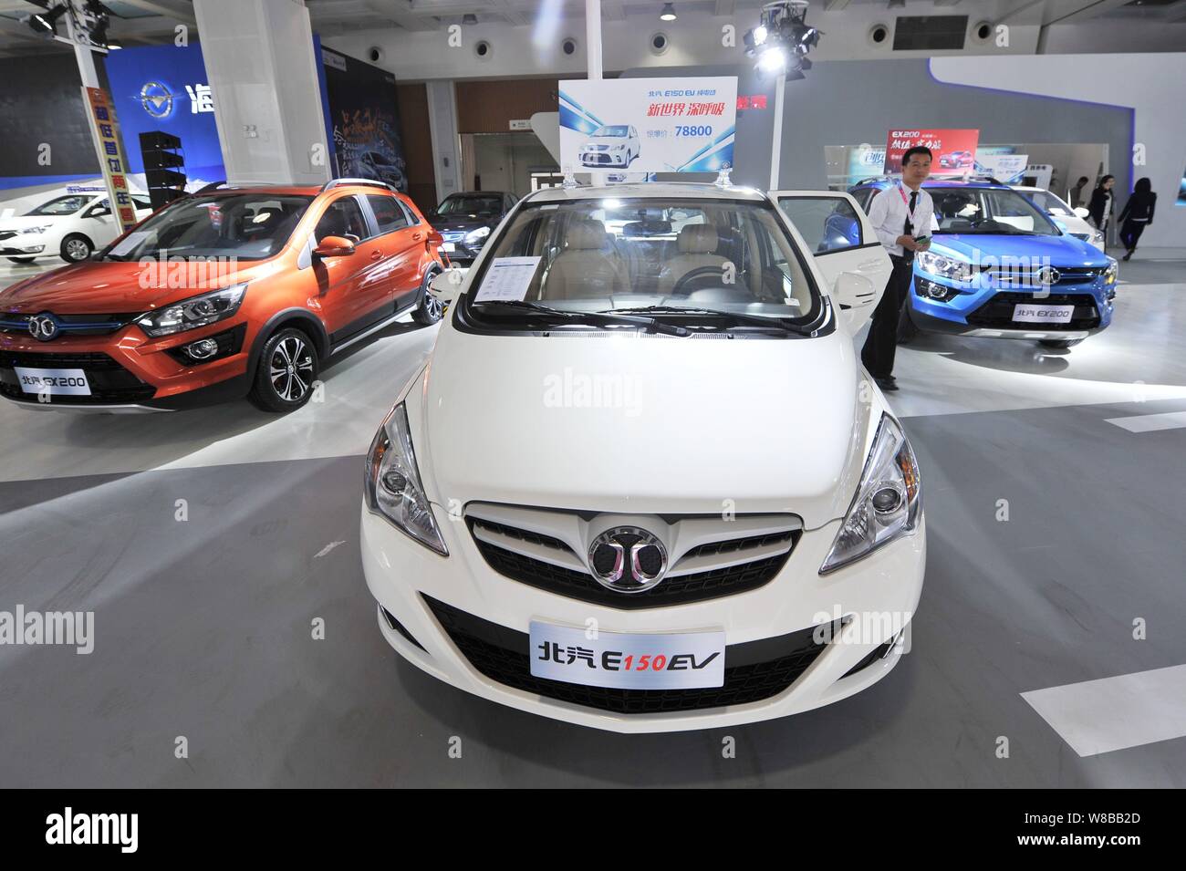An E150 EV of BAIC is on display during an automobile exhibition in Qingdao city, east China's ...