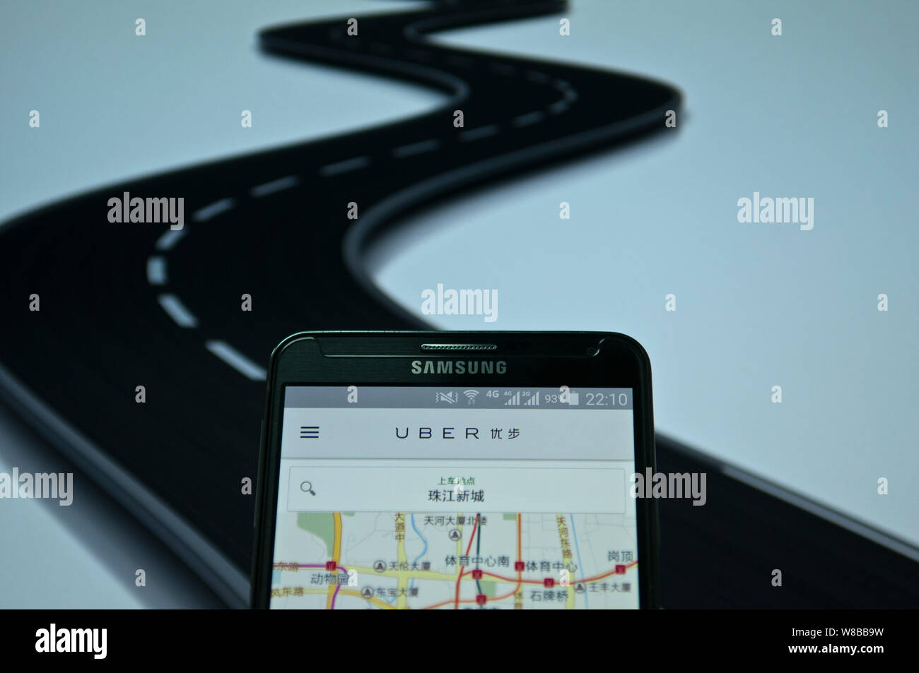 --FILE--The car-hailing app Uber is used on a smartphone in Guangzhou ...