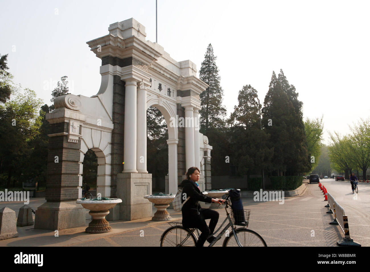 --FILE--A Chinese student cycles through a gate of Tsinghua University ...