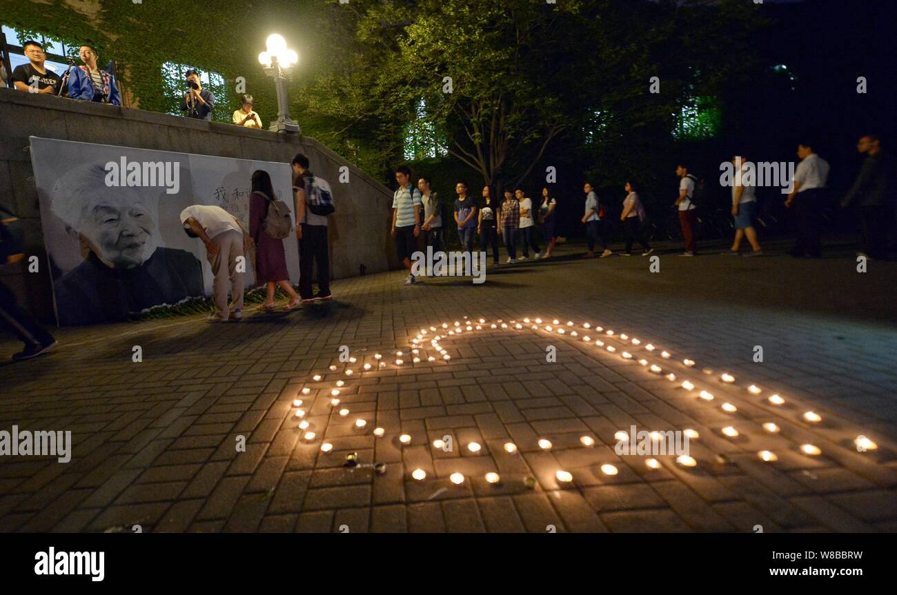 People light candles to mourn for Chinese writer and translator Yang ...