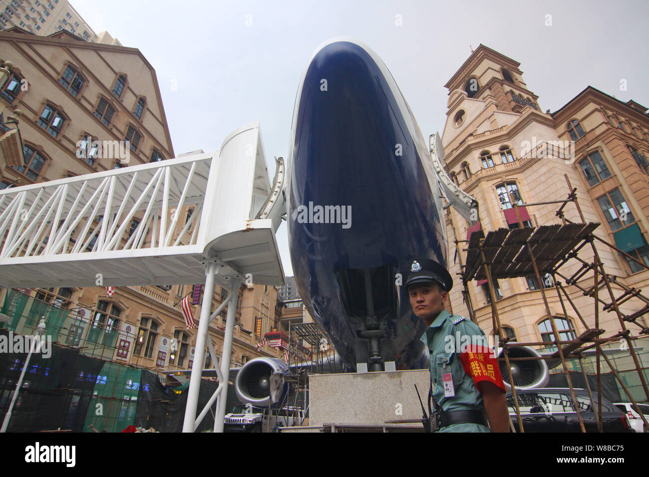 A security guard walks past a retired Boeing 737 passenger jet of ...