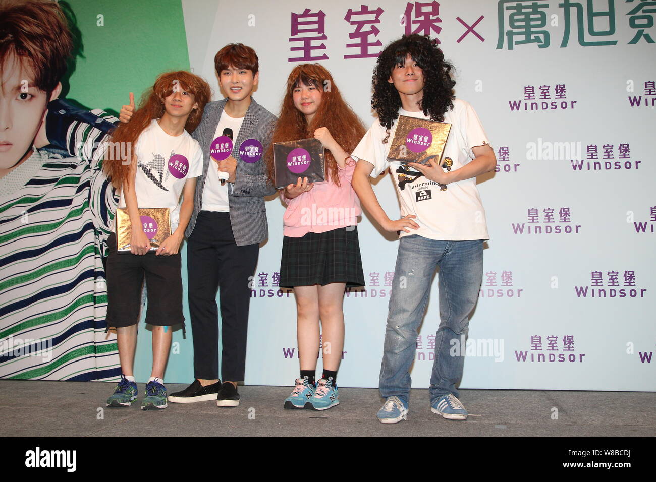 Singer and actor Kim Ryeo-wook, second left, better known by the ...