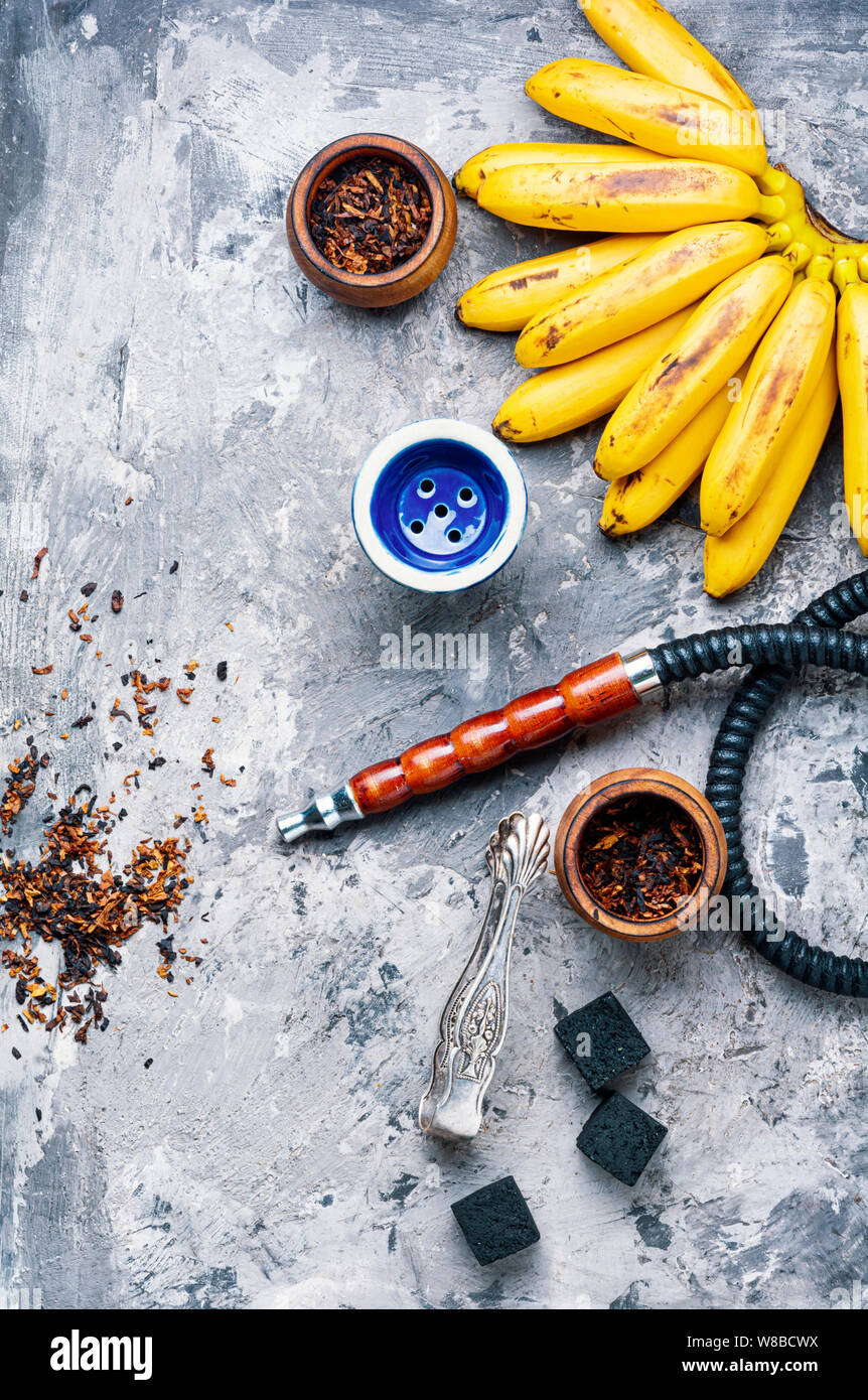 Tobacco shisha with banana aroma.Kalian with banana Stock Photo - Alamy