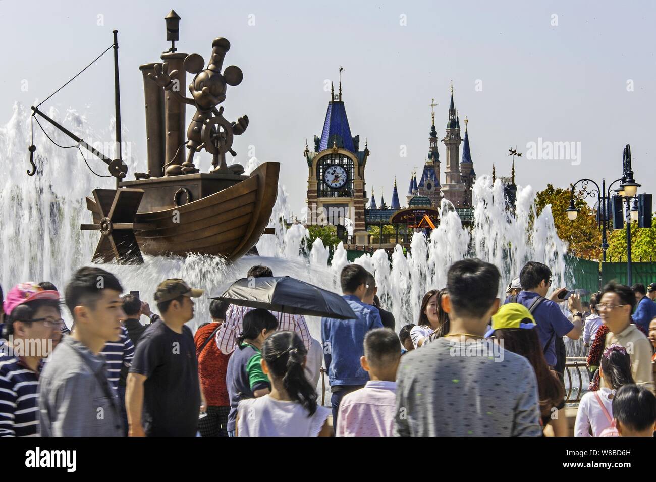 Tourists crowd Disneytown at the Shanghai Disney Resort in Pudong ...