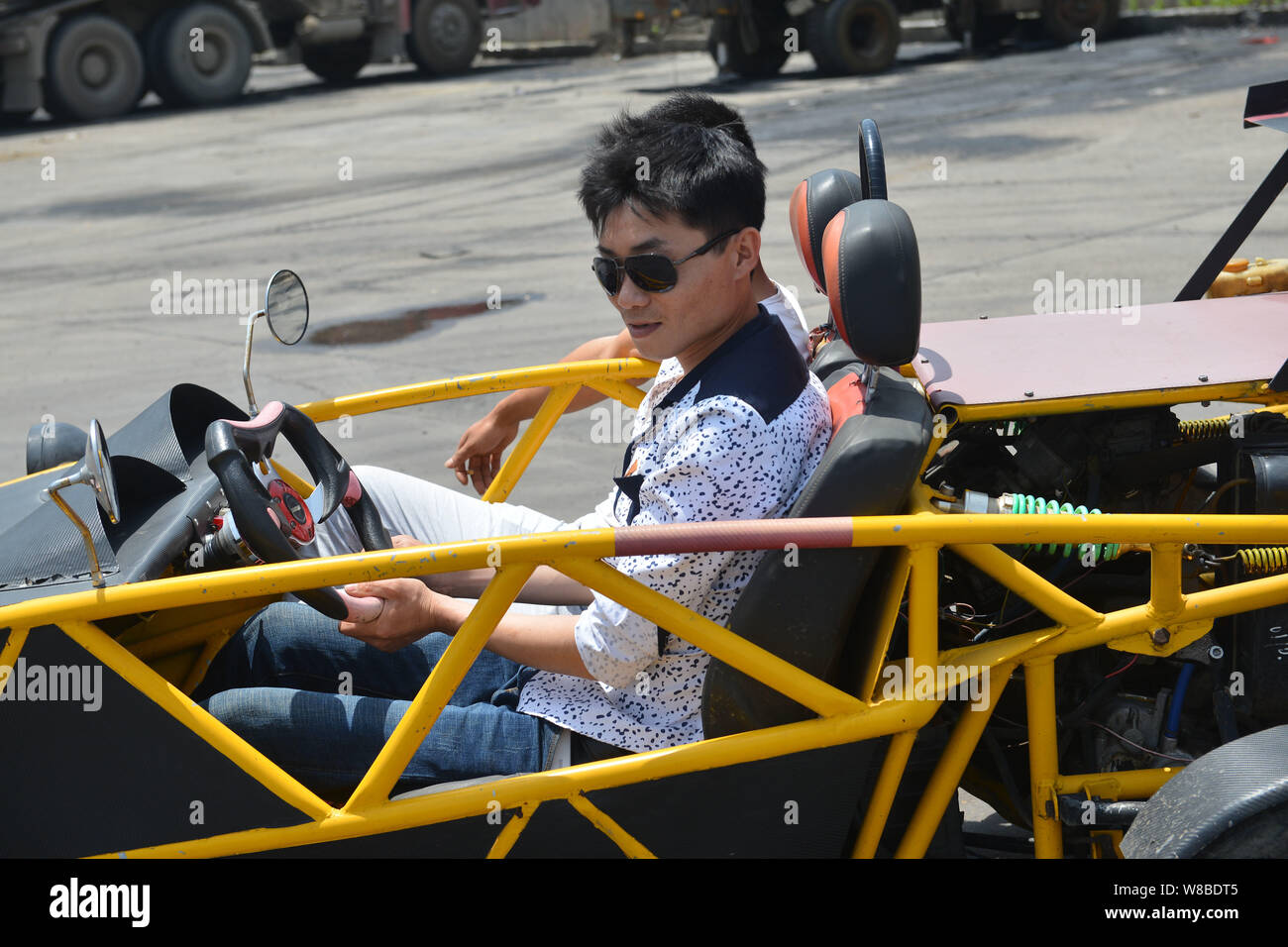 Chinese car repairman Wen Chao test-drives his homemade sports car, a ...