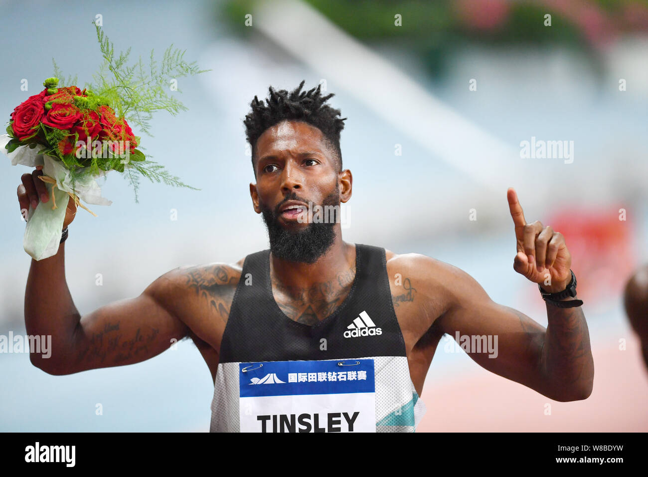Michael Tinsley of the United States celebrates after winning the men's ...