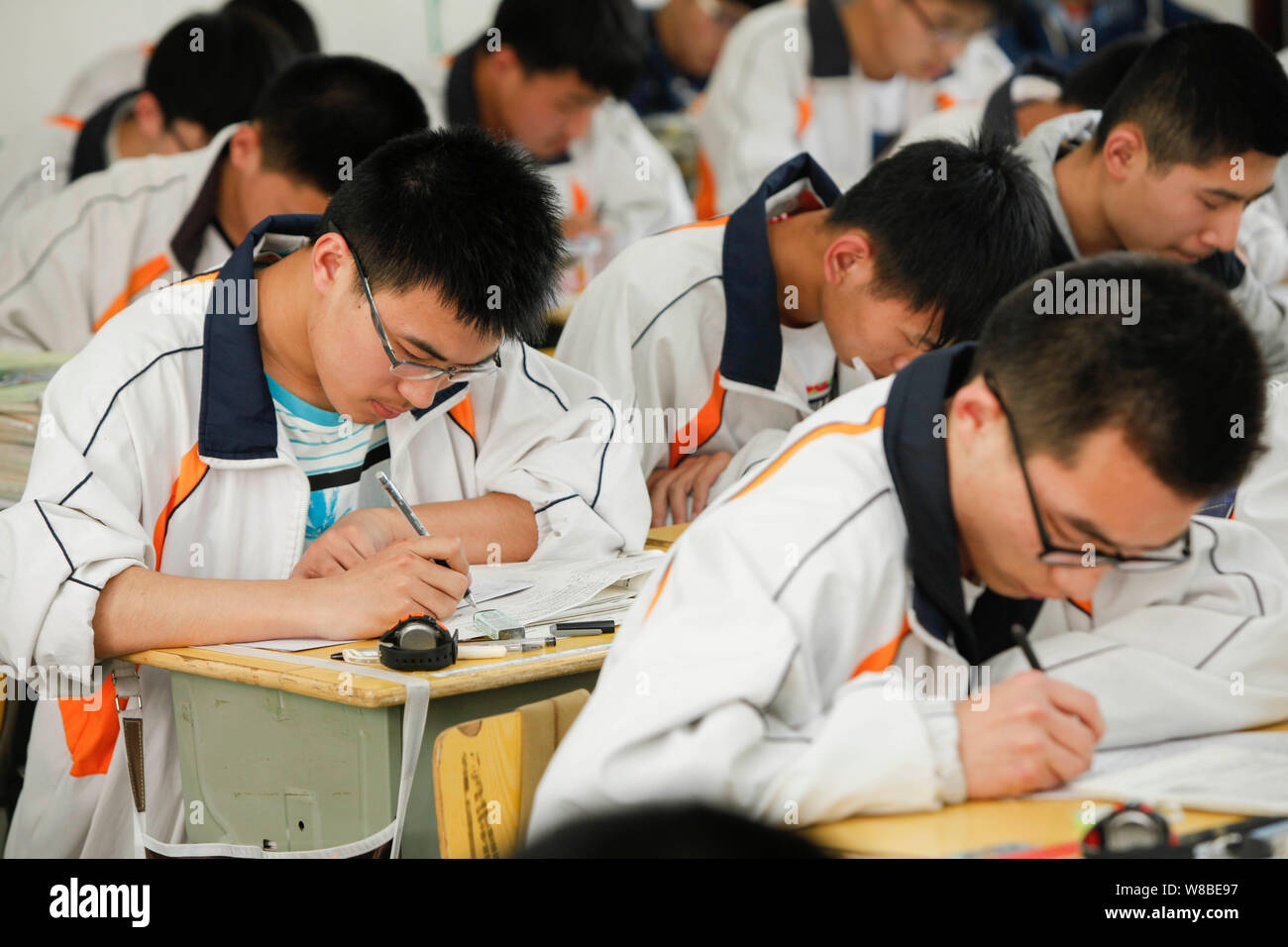 Chinese students review textbooks in preparation for the upcoming ...
