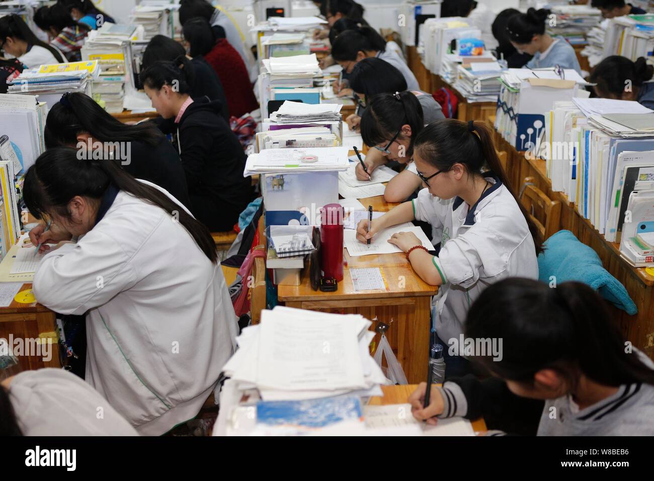 Chinese students review textbooks in preparation for the upcoming ...