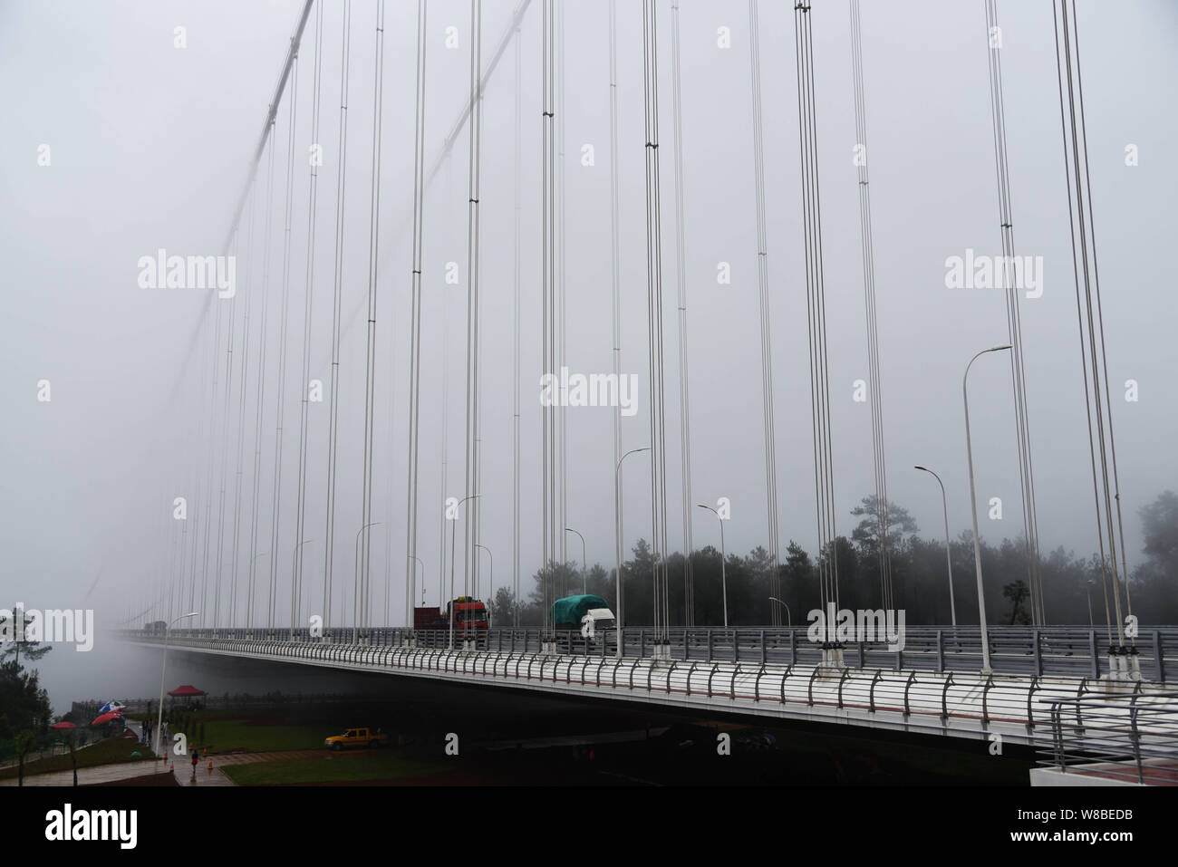 View of the Longjiang Grand Bridge enveloped by mist and cloud on the ...