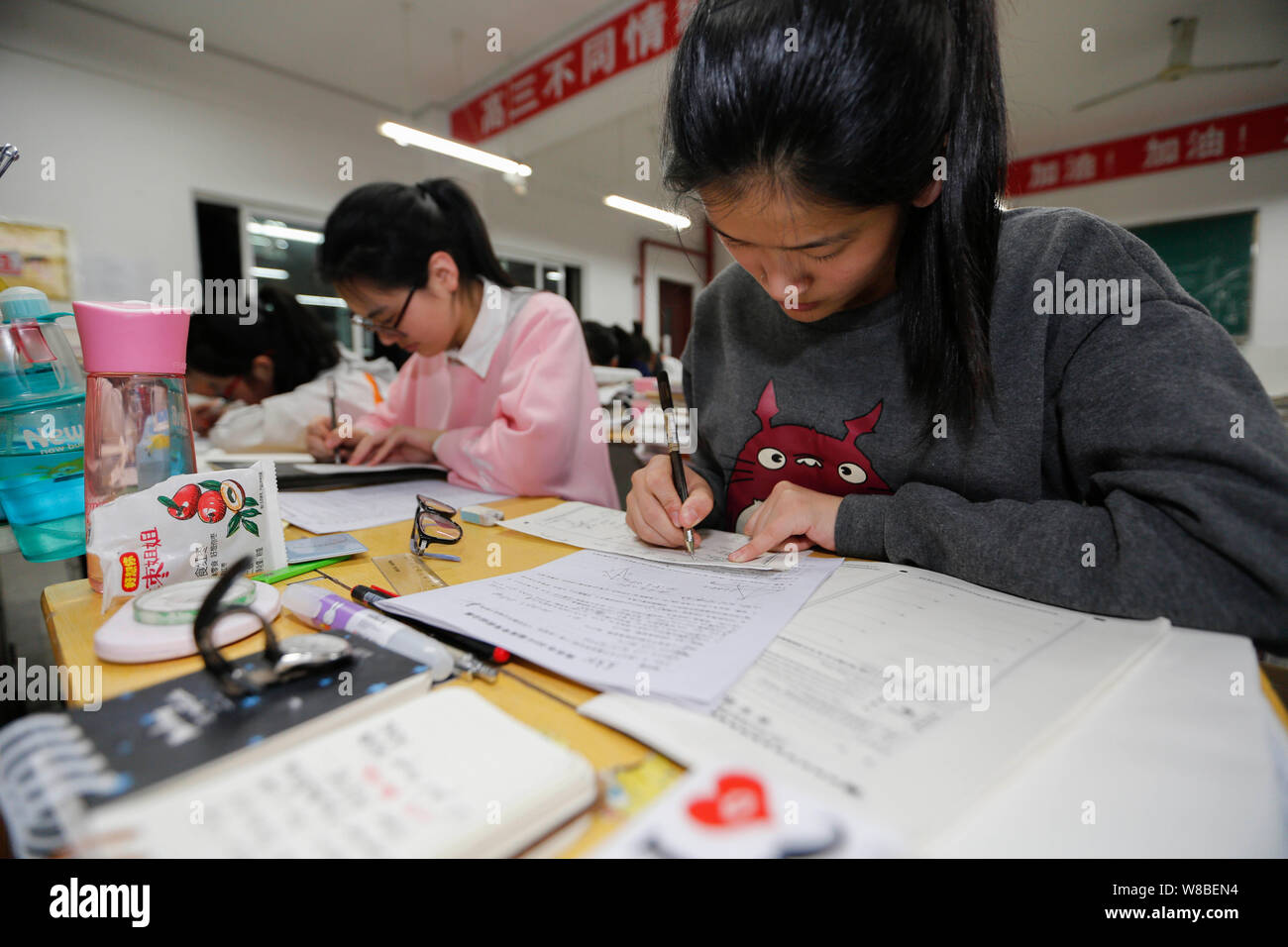 Chinese students review textbooks in preparation for the upcoming ...