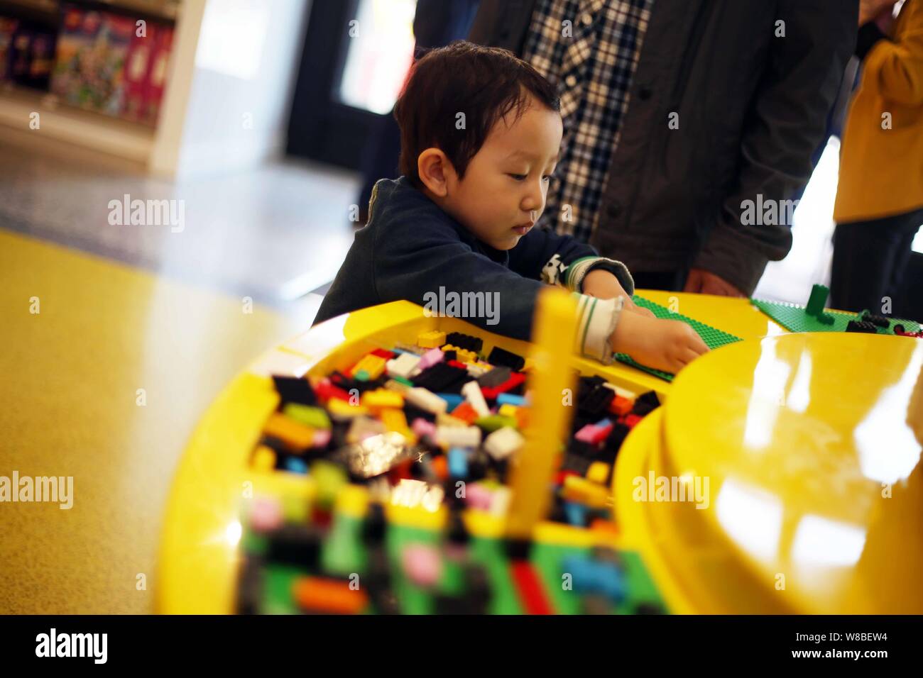 A young boy plays with Lego bricks at the Lego Flagship Store in the ...