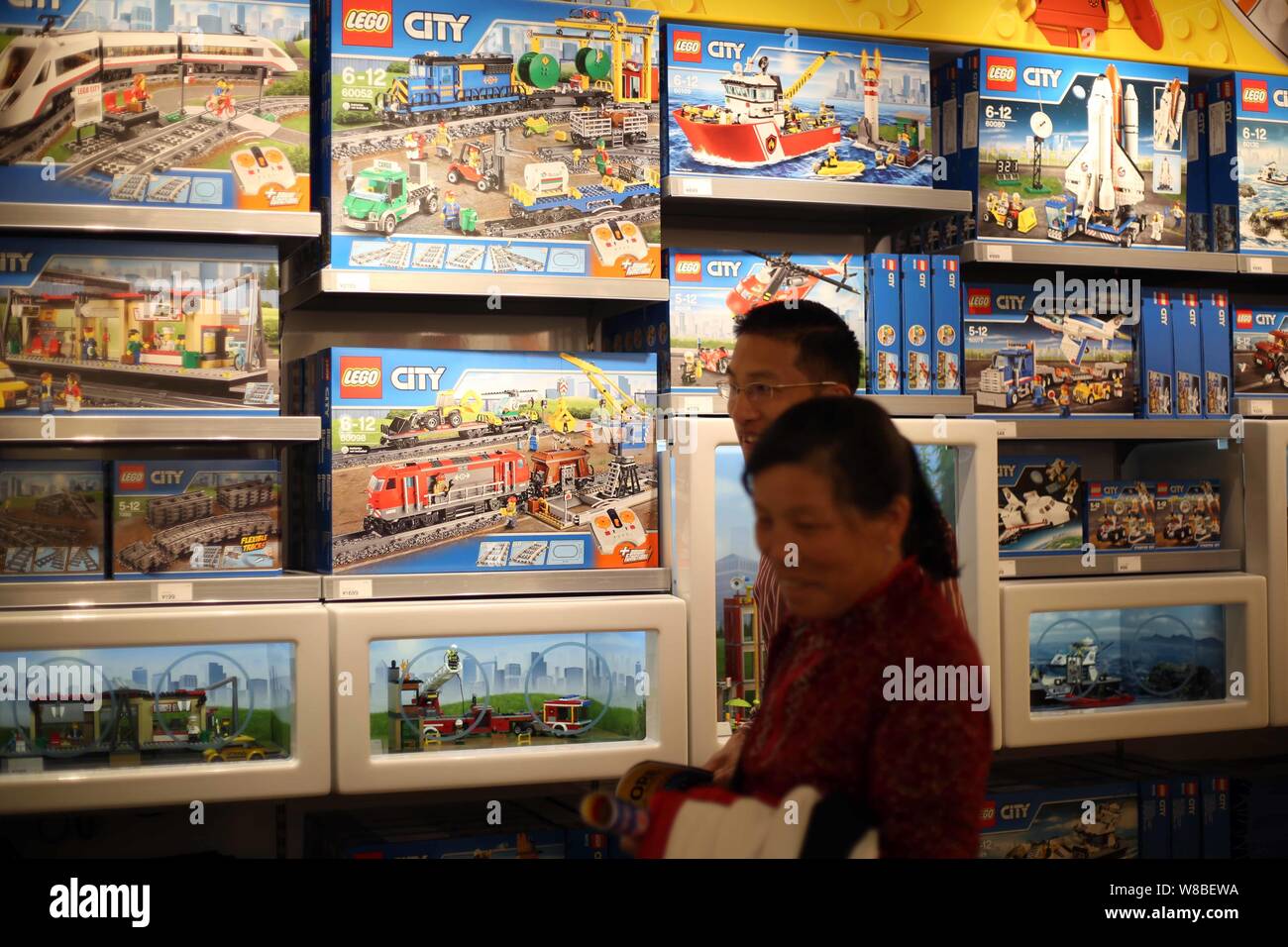Customers shop at the Lego Flagship Store in the Disney Town of the ...