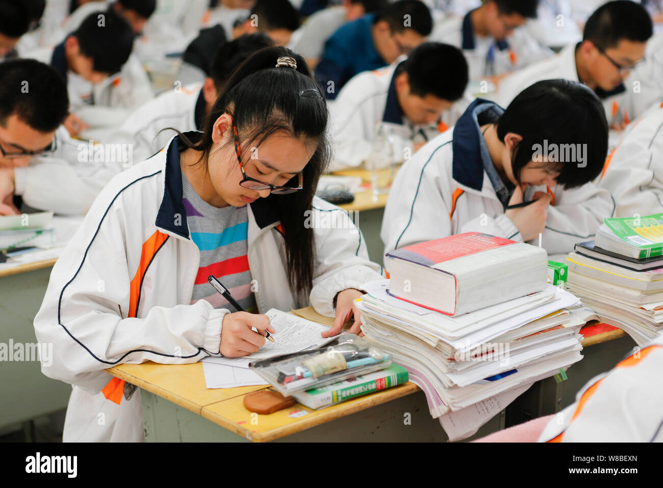 Chinese students review textbooks in preparation for the upcoming ...