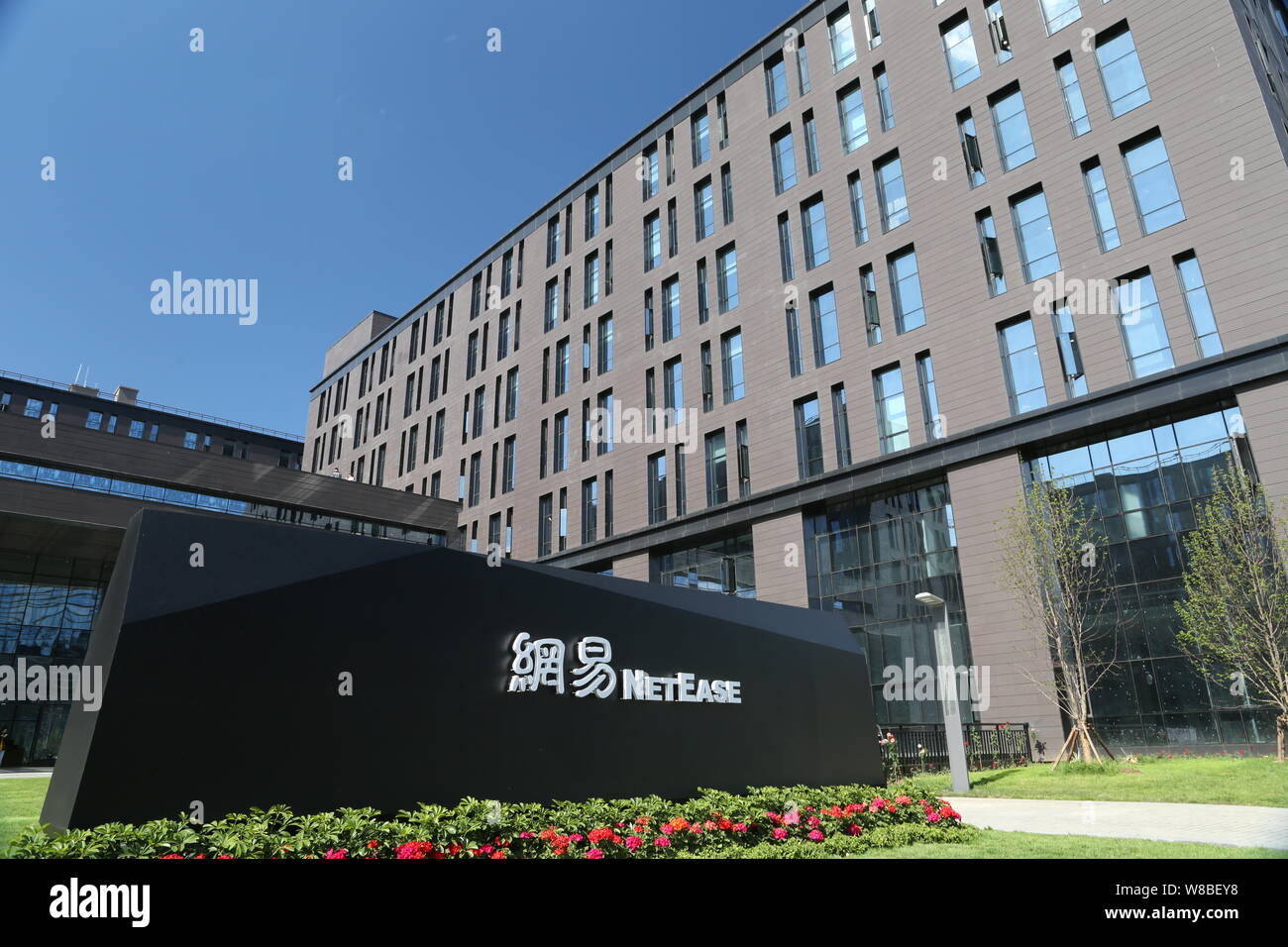 View of a logo of NetEase in front of the headquarters of NetEase in ...