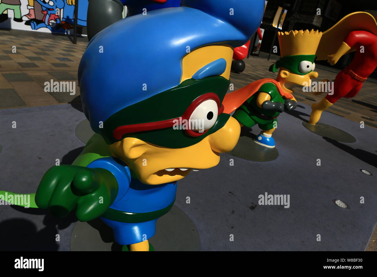 Model figures of The Simpsons are on display in front of The Simpsons ...