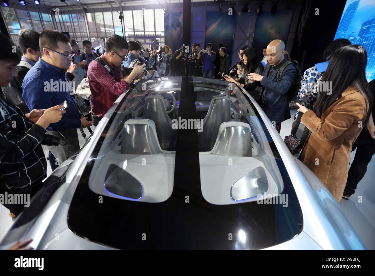 Visitors look at a Mercedes-Benz Concept IAA on display ahead of the ...
