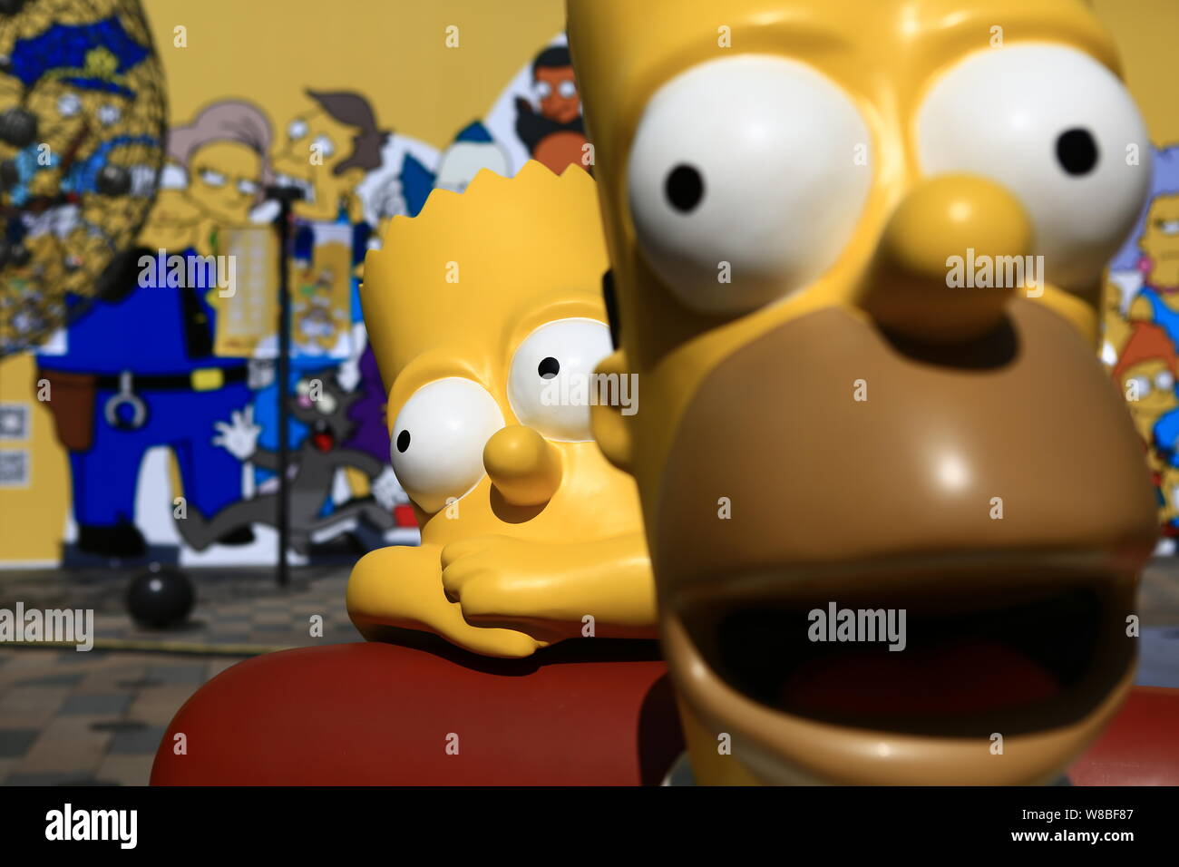 Model figures of The Simpsons are on display in front of The Simpsons ...
