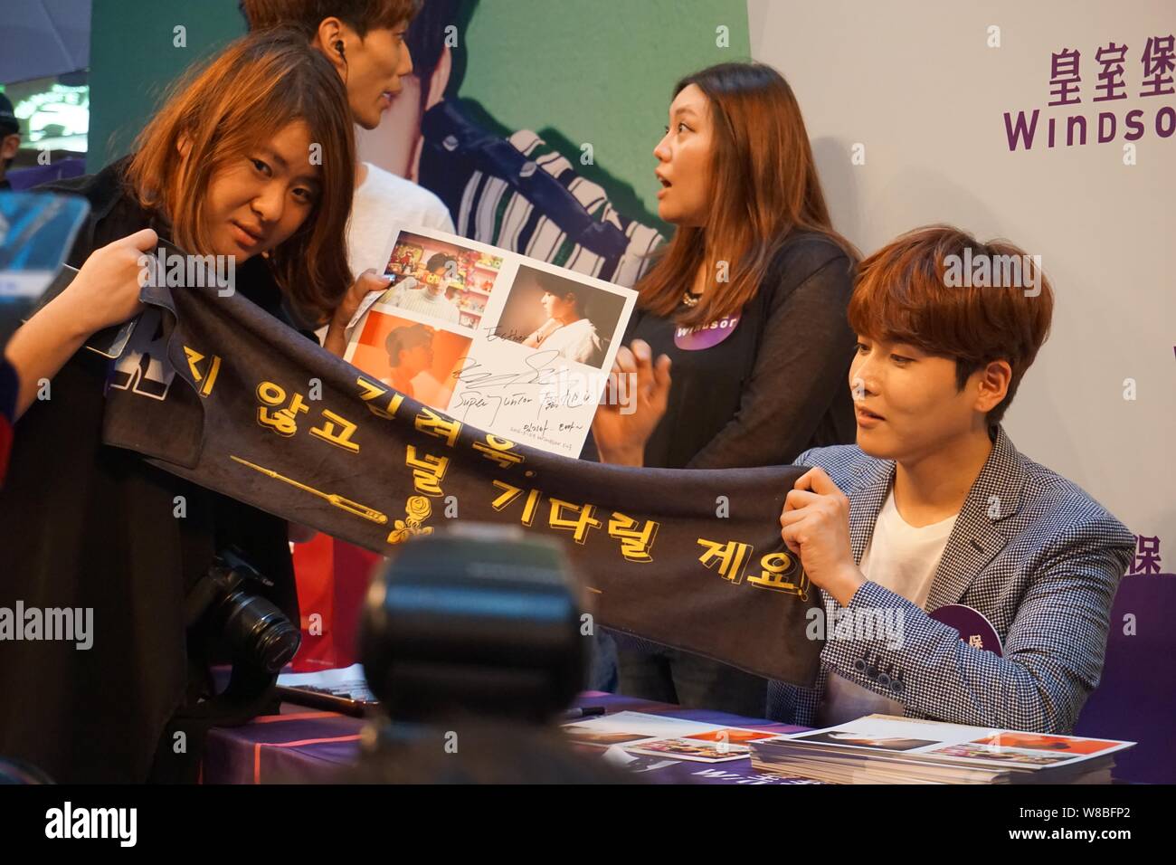 Singer and actor Kim Ryeo-wook, right, better known by the mononym ...