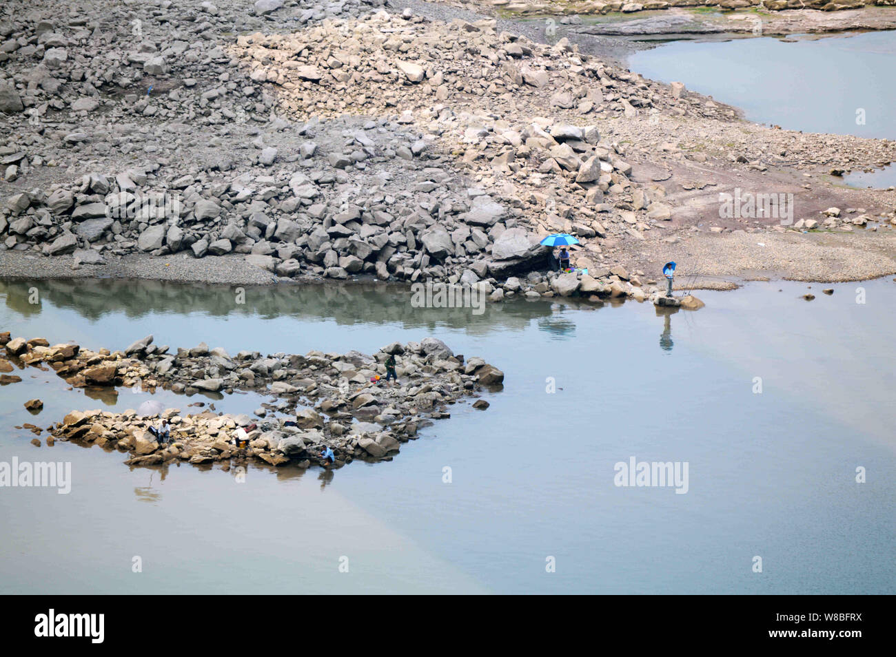 View of the exposed riverbed as water levels dropped on the ...