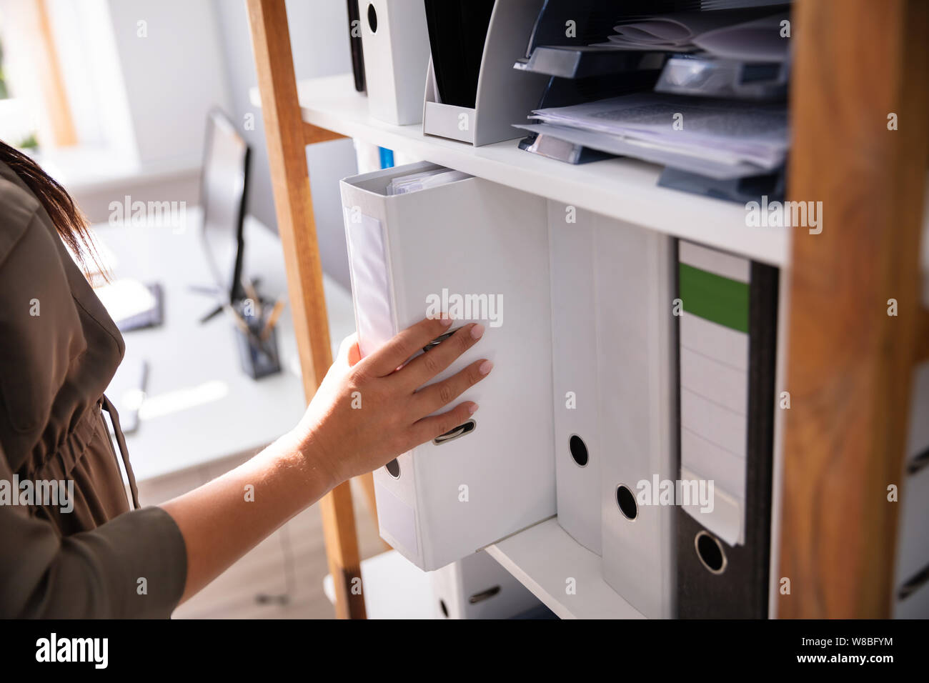 Woman office file taking hi-res stock photography and images - Alamy