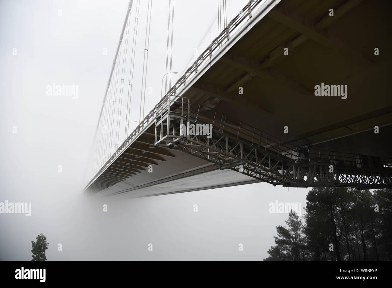View of the Longjiang Grand Bridge enveloped by mist and cloud on the ...