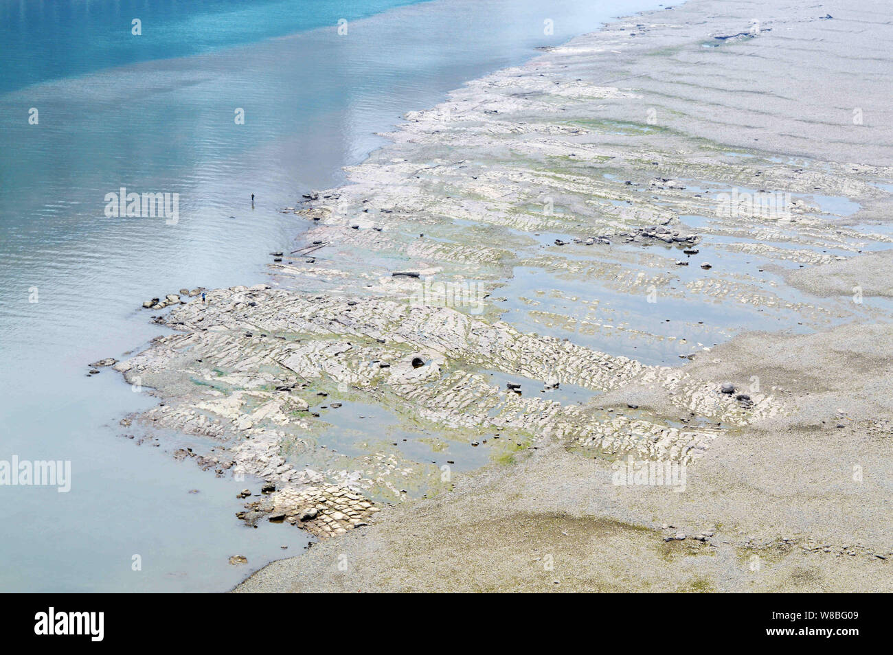 View of the exposed riverbed as water levels dropped on the ...