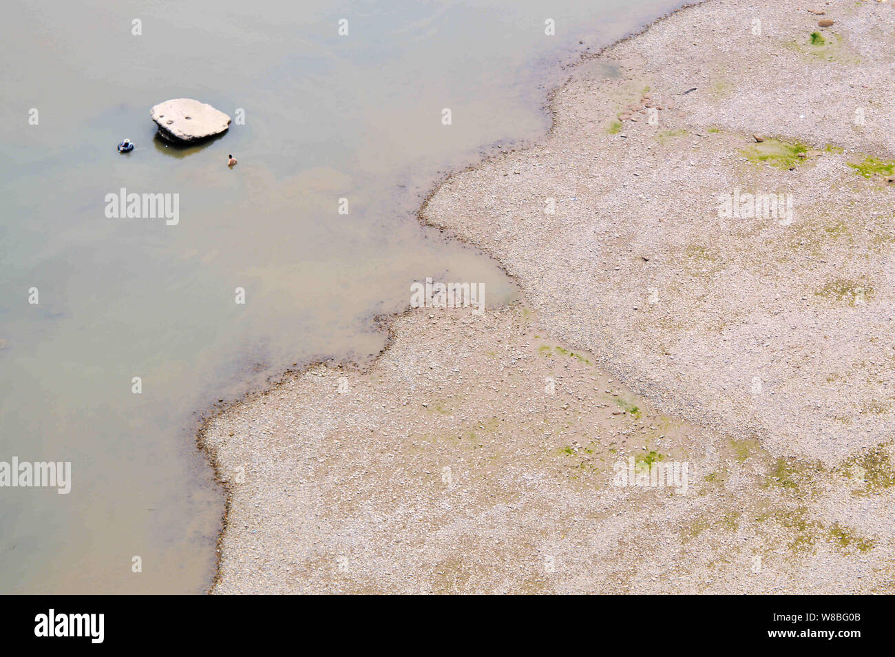 View of the exposed riverbed as water levels dropped on the ...