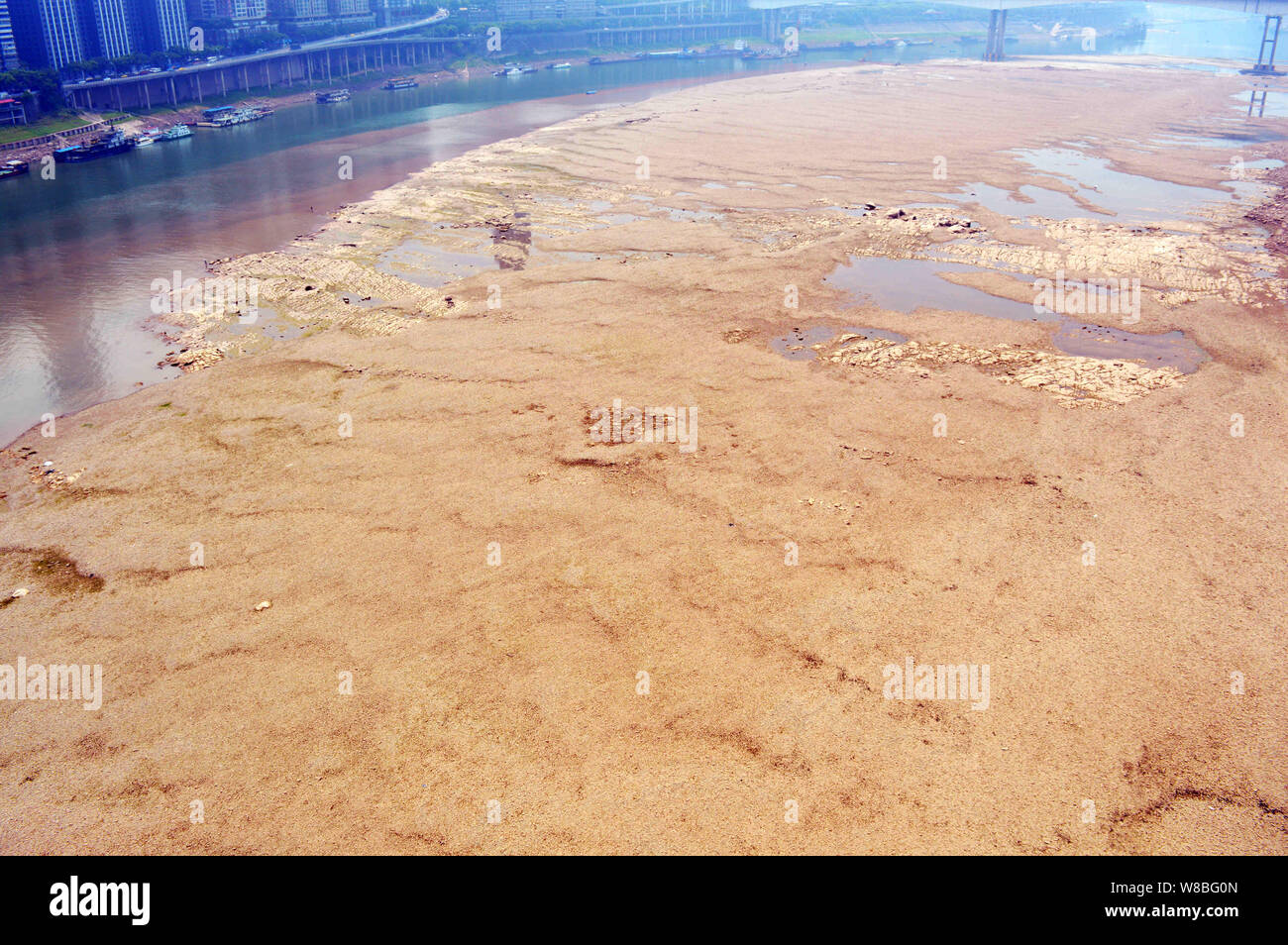 View of the exposed riverbed as water levels dropped on the ...